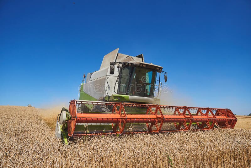 A Modern Combine Harvester Working a Wheat Field Stock Image - Image of ...