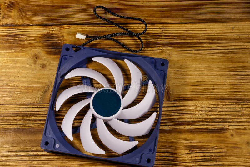 Modern Computer Fan on Wooden Desk. Top View Stock Photo - Image of ...