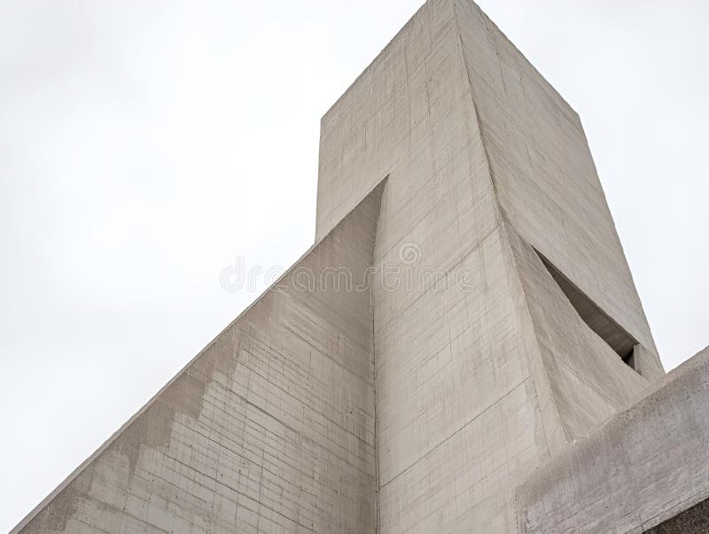 Modern Concrete Building with Sharp Angles Against Cloudy Sky Stock ...