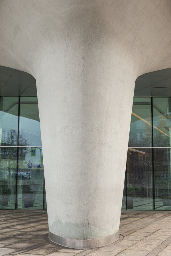 A Modern Concrete Pillar Supporting a Glass Building Facade Stock Image ...