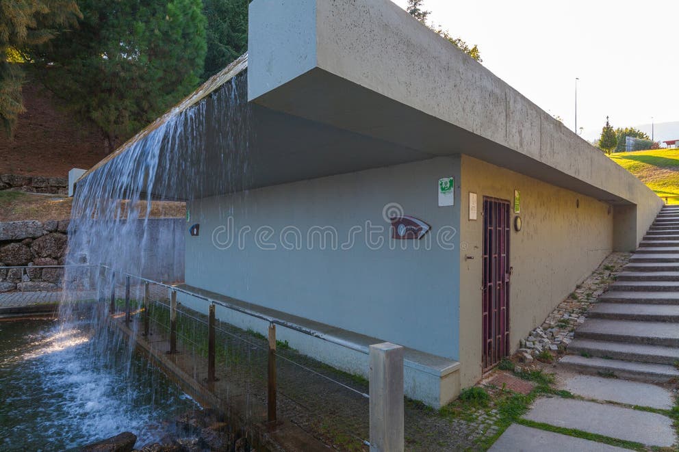 A Modern Concrete Structure with a Cascading Waterfall Feature Stock ...