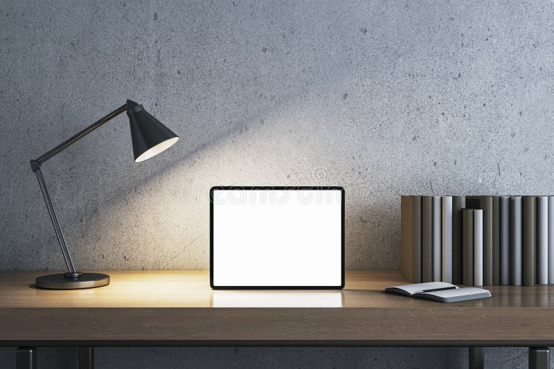 Modern Concrete Workplace with Lamp, Books and White Mock Up Tablet ...