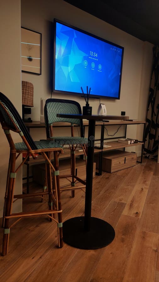 Modern Conference Room Setup with High Table, Stool, and Large Screen ...