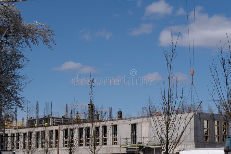 Modern Construction Site with Crane and Spring Trees Stock Image ...