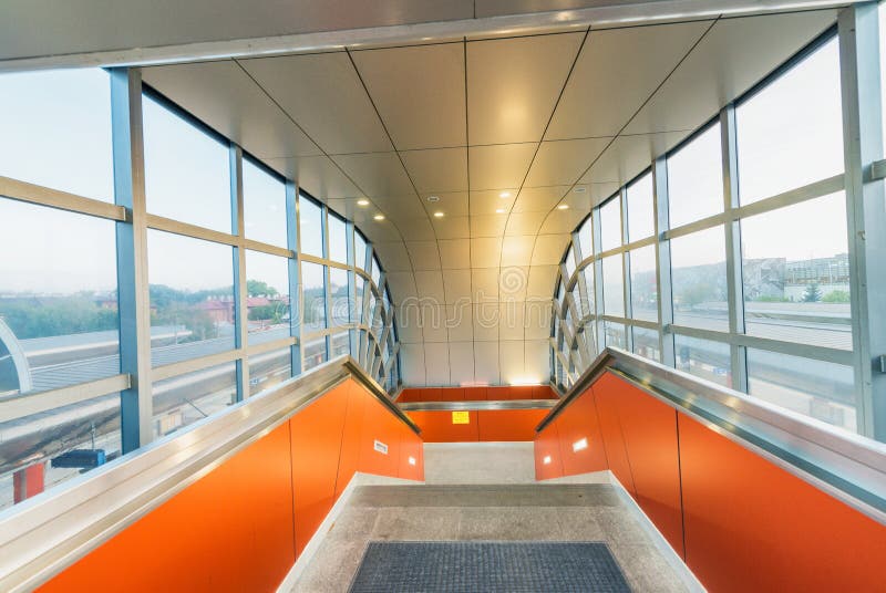 Modern Corridor with Staircase Surrounded by Glass Windows Stock Photo ...
