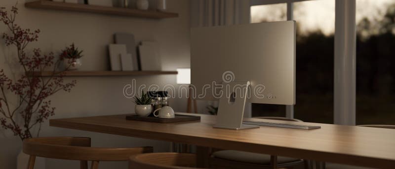 A Modern, Cosy Office Workspace in the Evening with a Computer on a ...