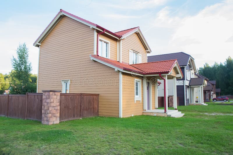 Modern cottage on sunset stock photo. Image of deck, district - 77564666