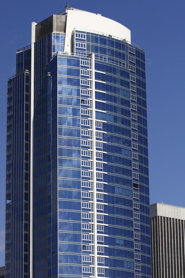 Modern Curved Blue Glass Office Tower Stock Photo - Image of seattle ...