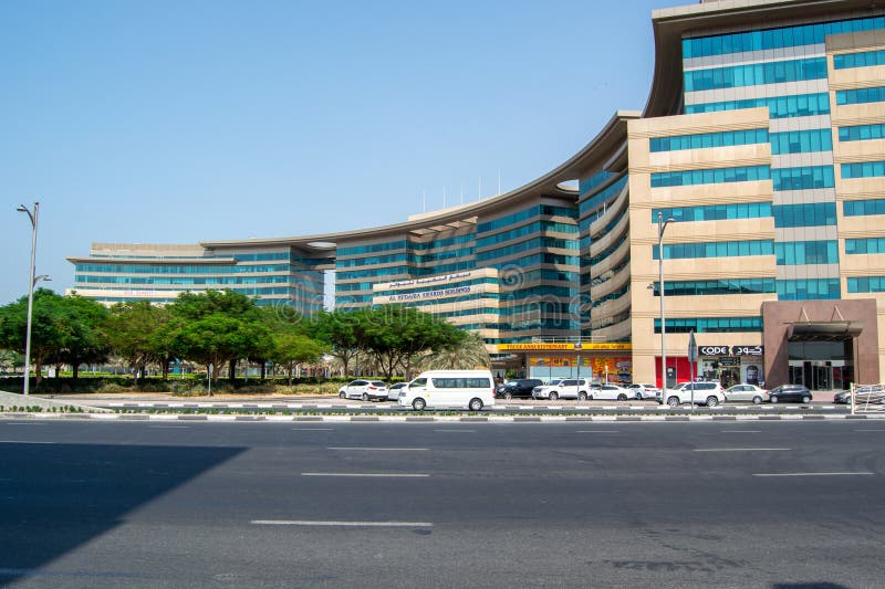 Modern Curved Commercial Building with Greenery Stock Image - Image of ...