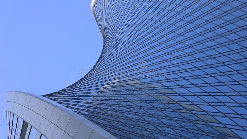 Modern Curved Skyscraper Against Blue Sky Stock Photo - Image of ...