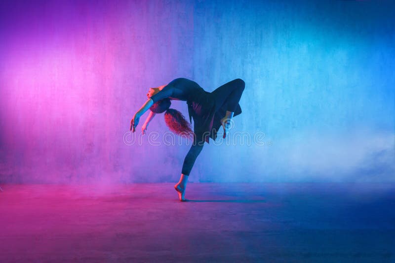 Modern Dance Girl Dancer Dancing in Neon Light Doing Gymnastic ...
