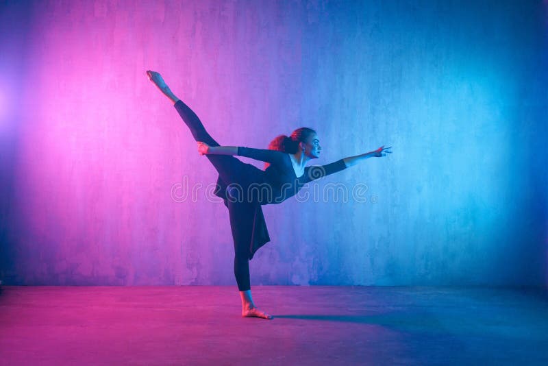 Modern Dance Girl Dancer Dancing in Neon Light Doing Gymnastic ...