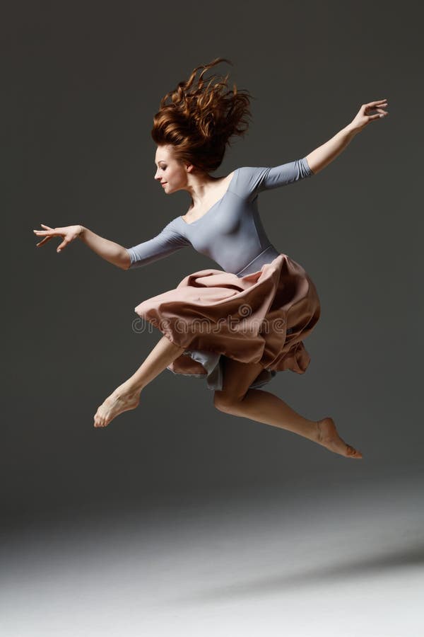 The Modern Dancer Jumping on a Gray Background Stock Photo - Image of ...