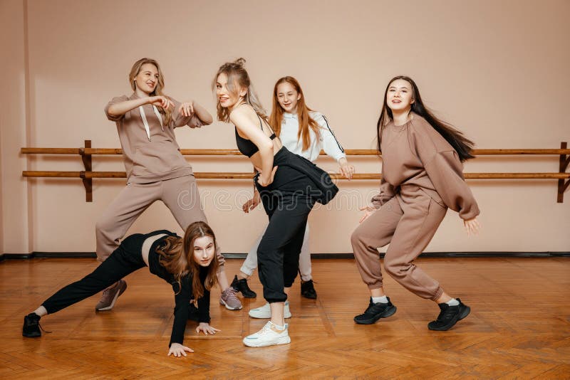 Modern Dancers Pose Against the Background of a Dance Studio ...