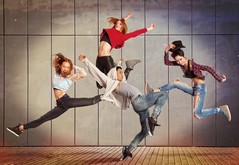 Modern Dancing Group Practice Dancing in Front Wall Stock Photo - Image ...
