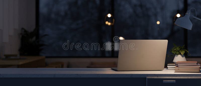 A Modern Dark Office at Night Features a Laptop Computer, Decor, and a ...