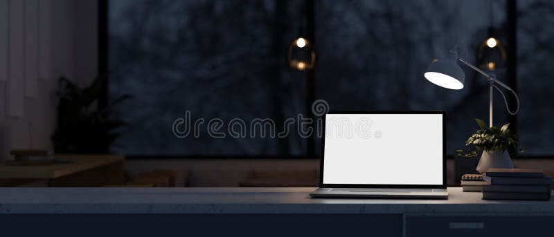 A Modern Dark Office at Night Features a White-screen Laptop Computer ...