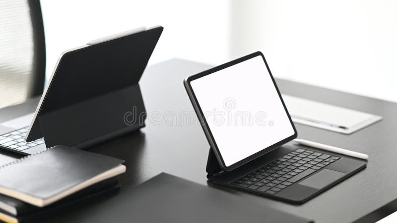 Modern Dark Surface Office Desk with Computer Laptop and Notebook ...