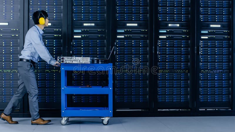 In the Modern Data Center: it Engineer Doing Maintenance and ...