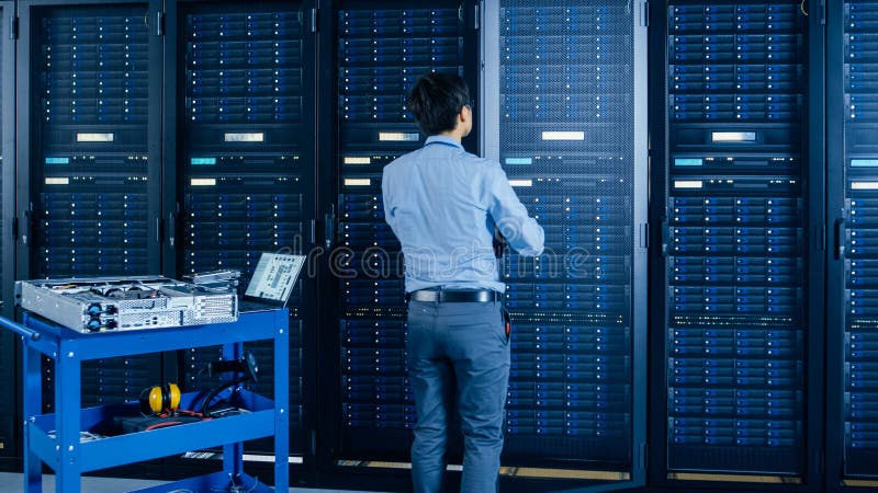 In the Modern Data Center: it Engineer Doing Maintenance and ...