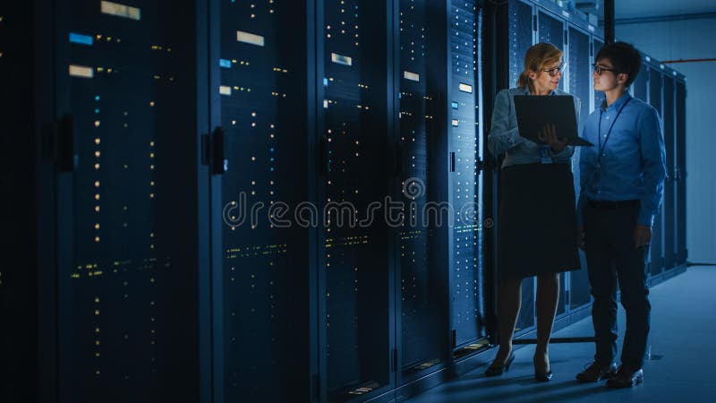 In the Modern Data Center: Engineer and it Specialist Work with Server ...