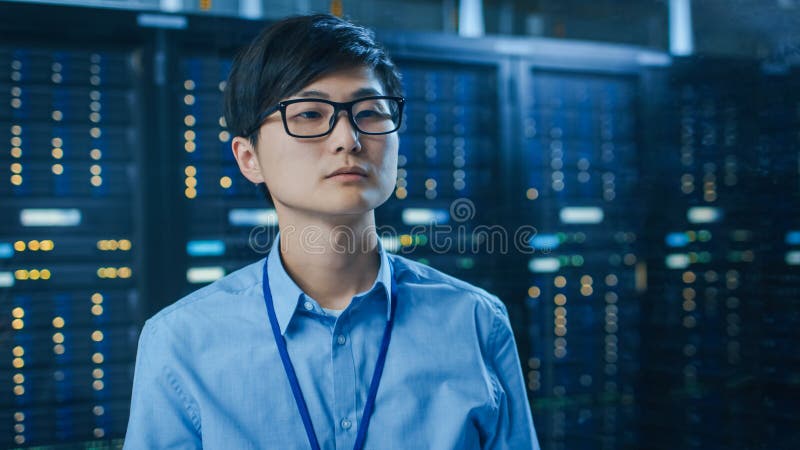 In the Modern Data Center: it Engineer Standing beside Server Rack Cabinets, Does Wireless Stock ...