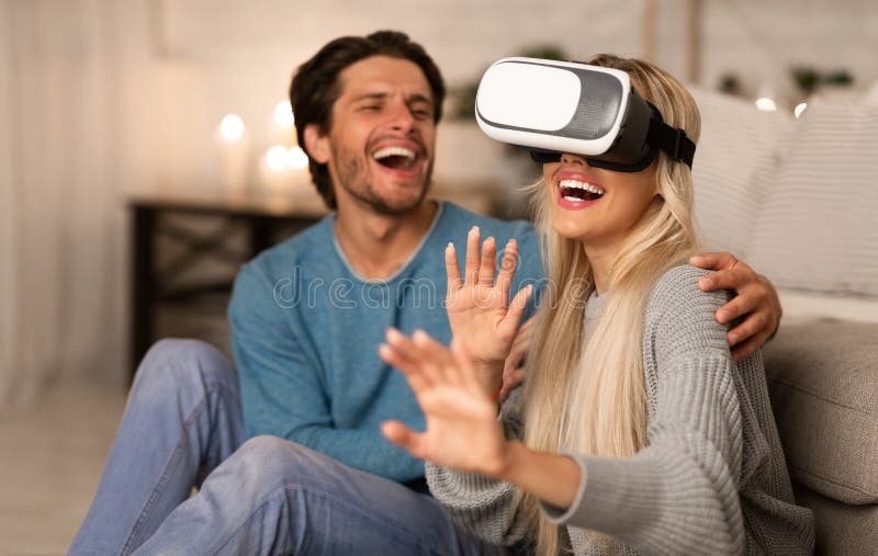 Millennial Couple Experiencing Virtual Reality at Home Stock Photo ...