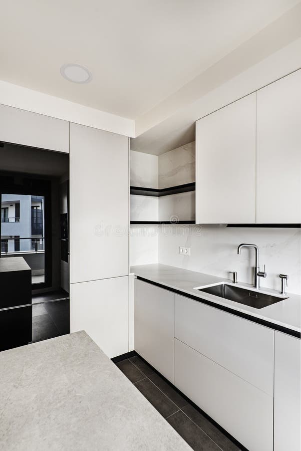 Modern Designed Kitchen with Smooth Handleless Cabinets with Black ...