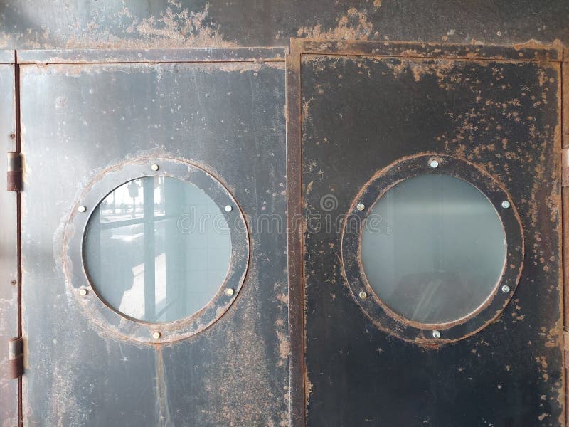 Modern Designed Rusty Doors with Circular Windows Off Naval Style Stock ...
