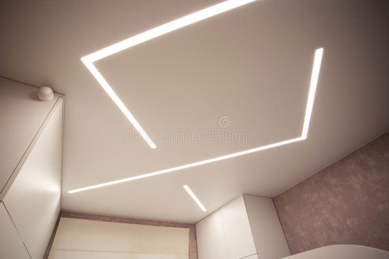 Modern Designer Stretch Ceiling with Illuminated LED Lines in the Room ...