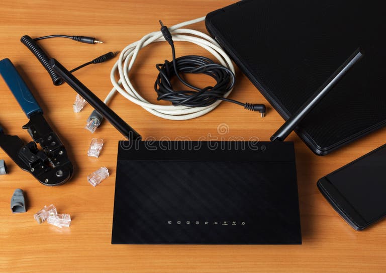 Modern Devices and Router, Modem Connection Parts and Tools on Table ...