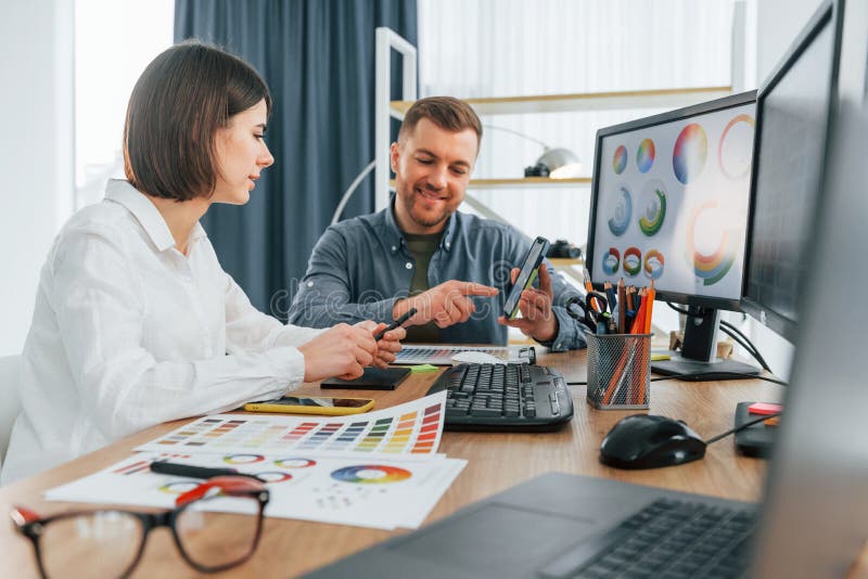 Modern Digital Technologies. Two Designers Working Together in the ...