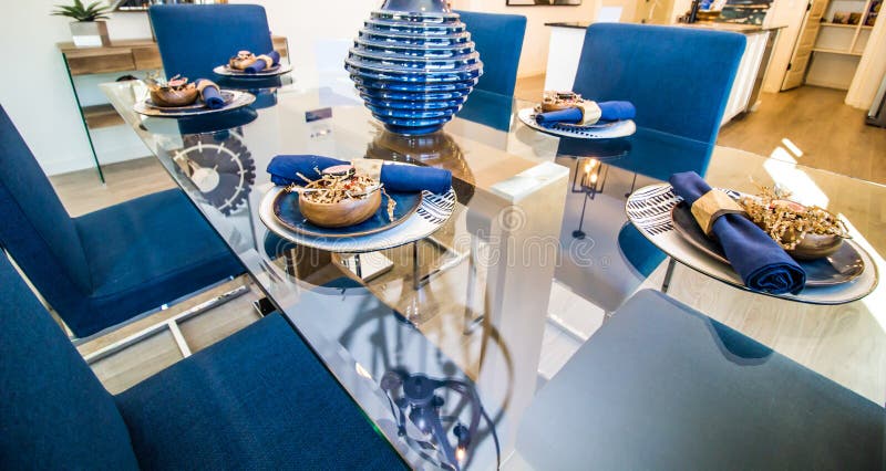 Modern Dining Area with Glass Table and Place Settings Stock Image ...