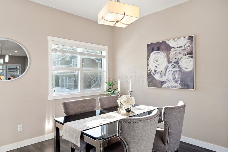 A Modern Dining Room with a Large Window and a White Wall Editorial ...