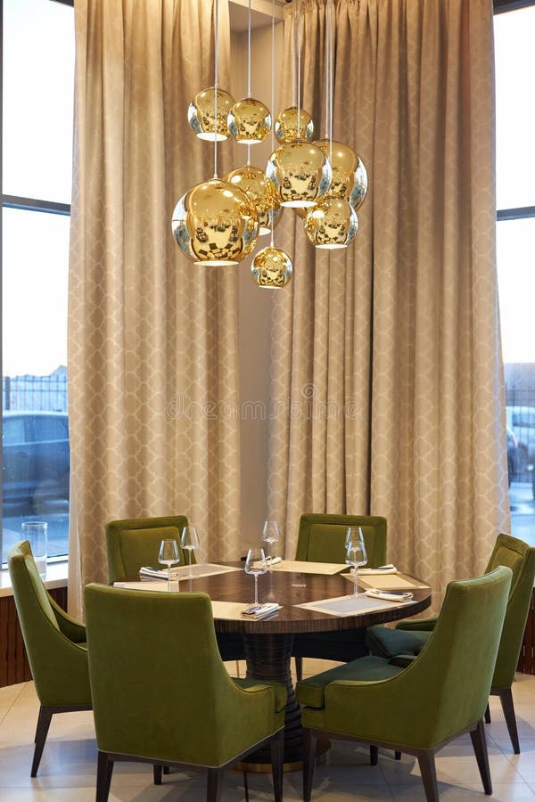 Modern Dining Room Setting with Large Pendant Lights Stock Image ...