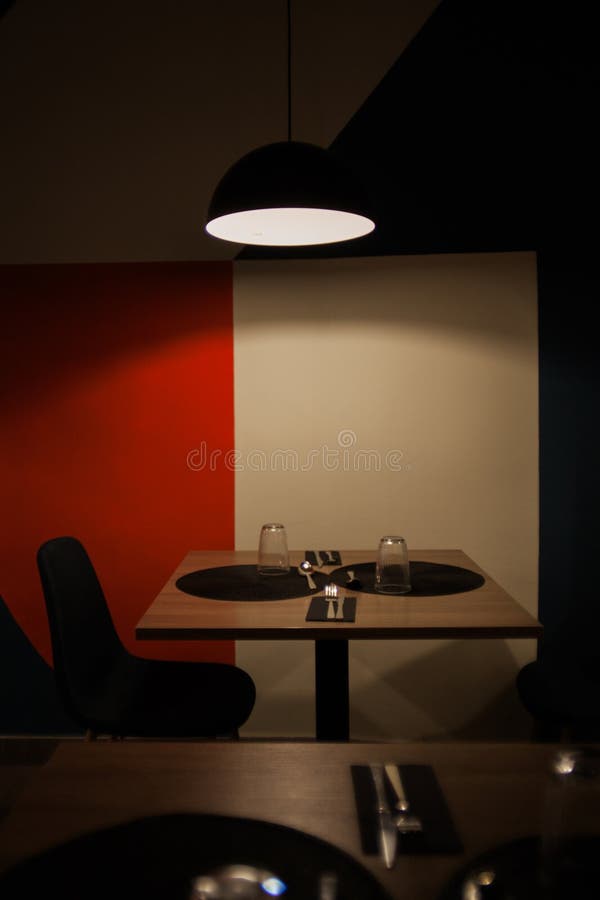 Modern Dining Table in Dimly Lit Restaurant Stock Image - Image of ...