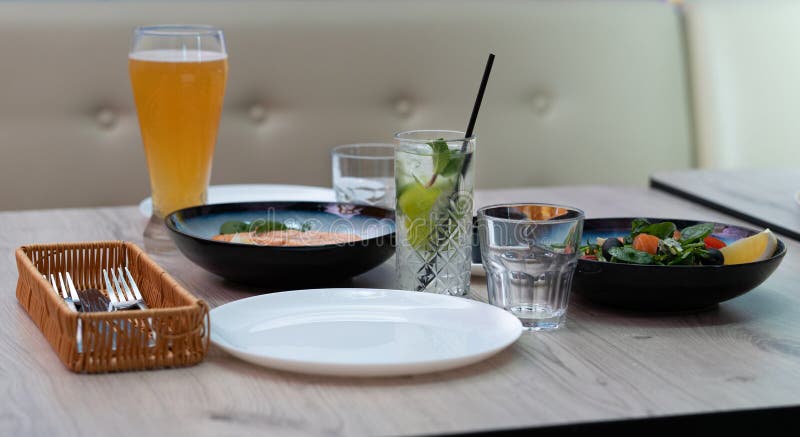 Modern Dining Table Set with Elegant Dinnerware, Fresh Salad ...