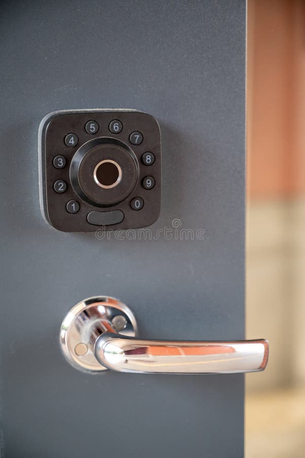 A Modern Door Features a Metallic Handle and an Electronic Keypad Lock ...
