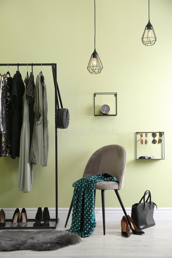 Modern Dressing Room Interior with Clothing Rack and Chair Stock Photo ...