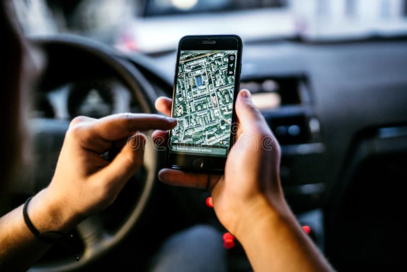 Modern Driver Using Online Maps and GPS Applications with Smartphone ...