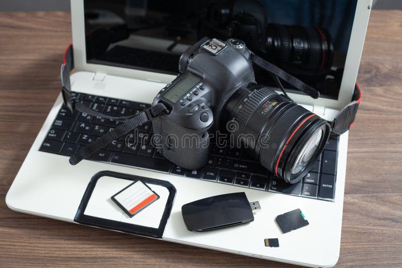 Modern DSLR Camera and Laptop Computer Stock Photo - Image of shutter ...