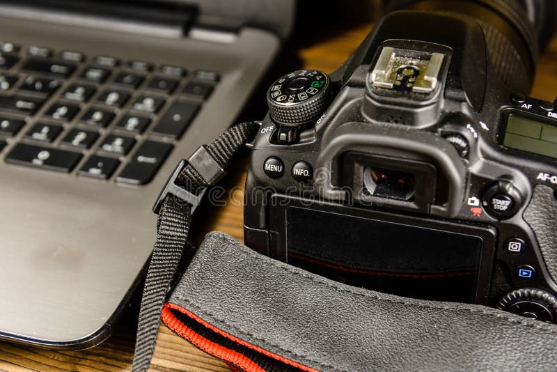 Modern DSLR Camera and Laptop on Wooden Table Stock Image - Image of ...