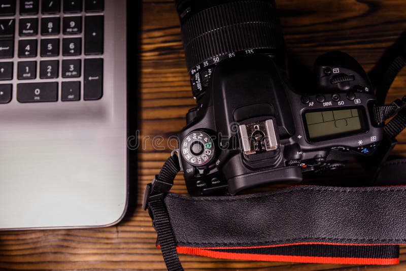 Modern DSLR Camera and Laptop on Wooden Table. Top View Stock Image ...