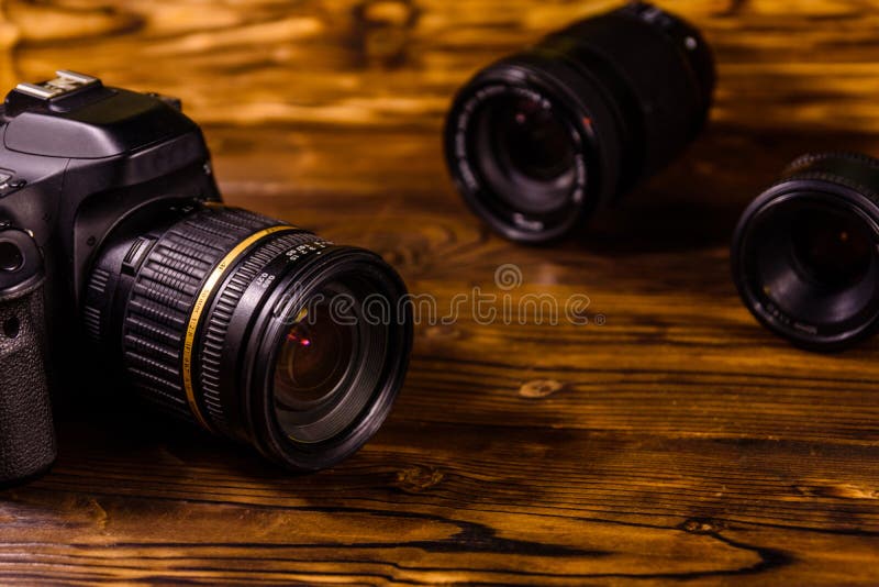 Modern Dslr Camera and Lenses on Wooden Table Stock Image - Image of ...