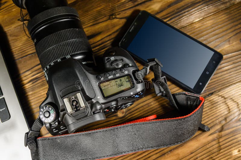 Modern DSLR Camera, Smartphone and Laptop on Wooden Table. Top View ...