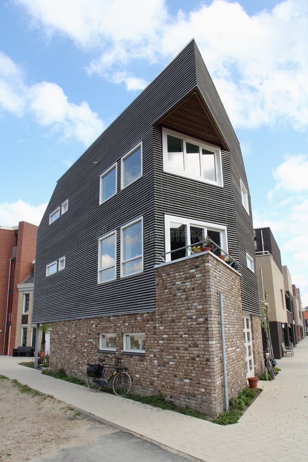 Modern Dutch Home with Wooden Curved Facade Stock Photo - Image of ...