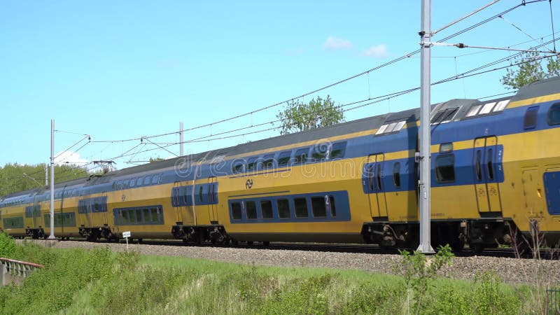 Modern Dutch Train Passing in Full Speed Stock Footage - Video of grass ...