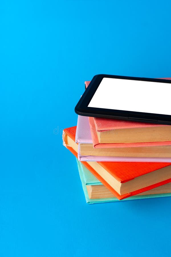 Modern E-book on Stack of Hardcover Books on Blue Background Stock ...