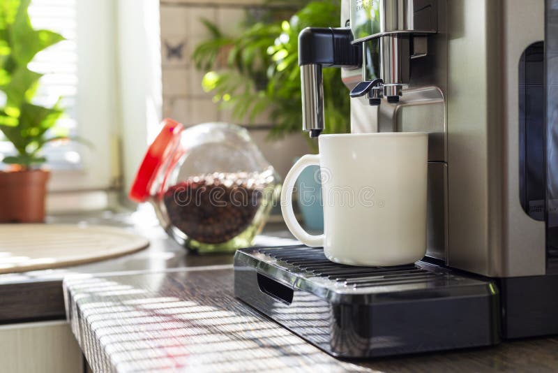 Modern Electric Coffee Machine with Cup on Countertop in Kitchen Stock ...
