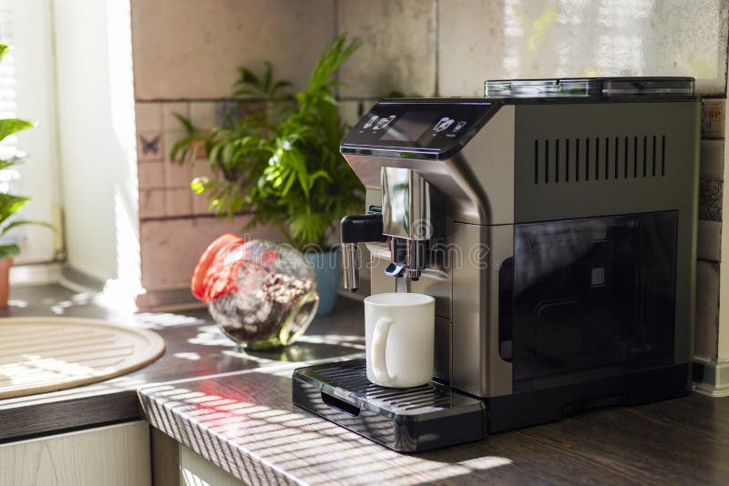 Modern Electric Coffee Machine with Cup on Countertop in Kitchen Stock ...